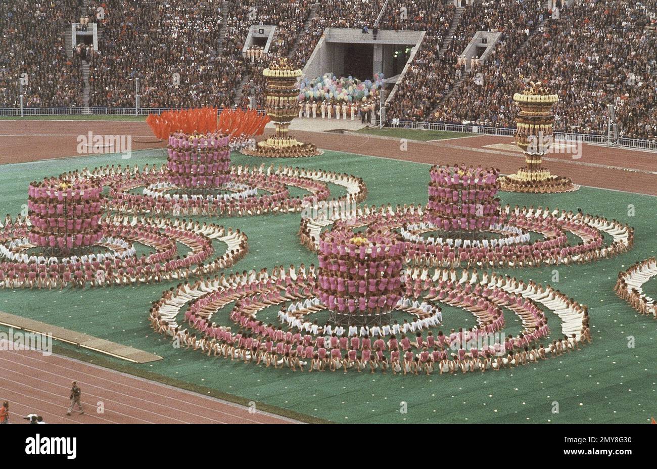 Spiraling human prymids occupy the field of the Lenin Stadium Saturday ...