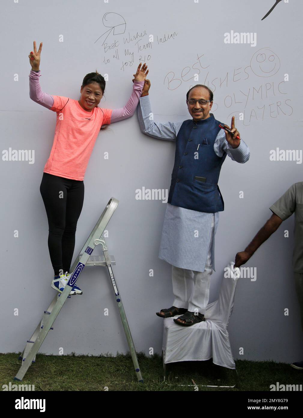 Indian boxer Mary Kom, left and Indian sports minister Vijay Goyal ...