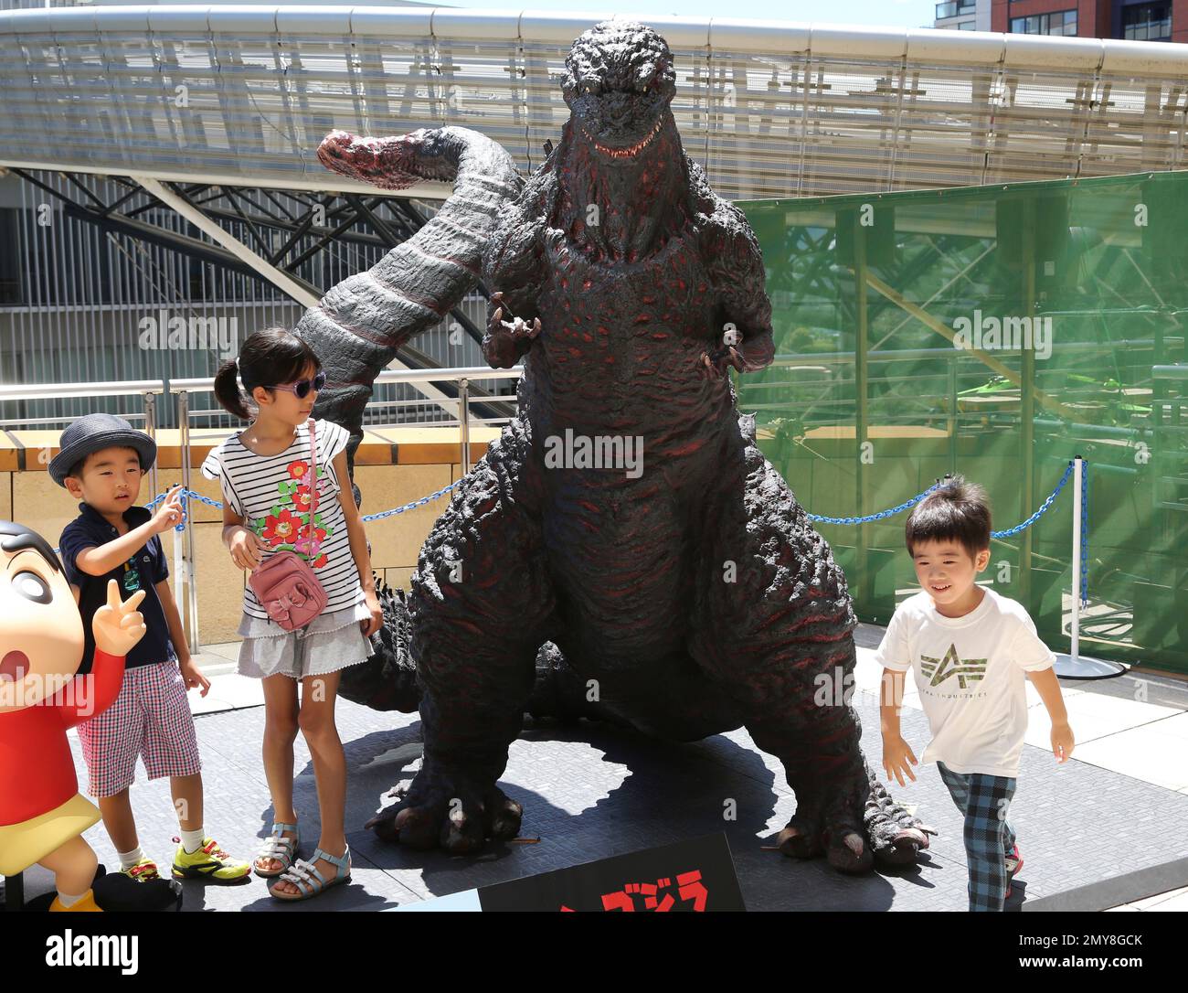 In this July 30, 2016 photo, children pose with a scaled down model of ...