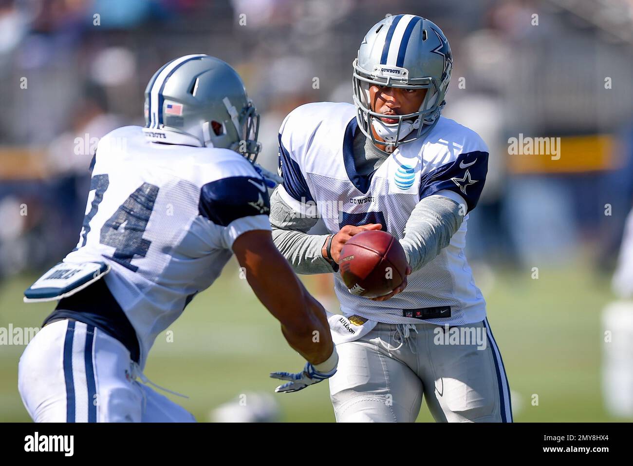 Dallas Cowboys quarterback Jameill Showers (7) hands off t Dallas ...