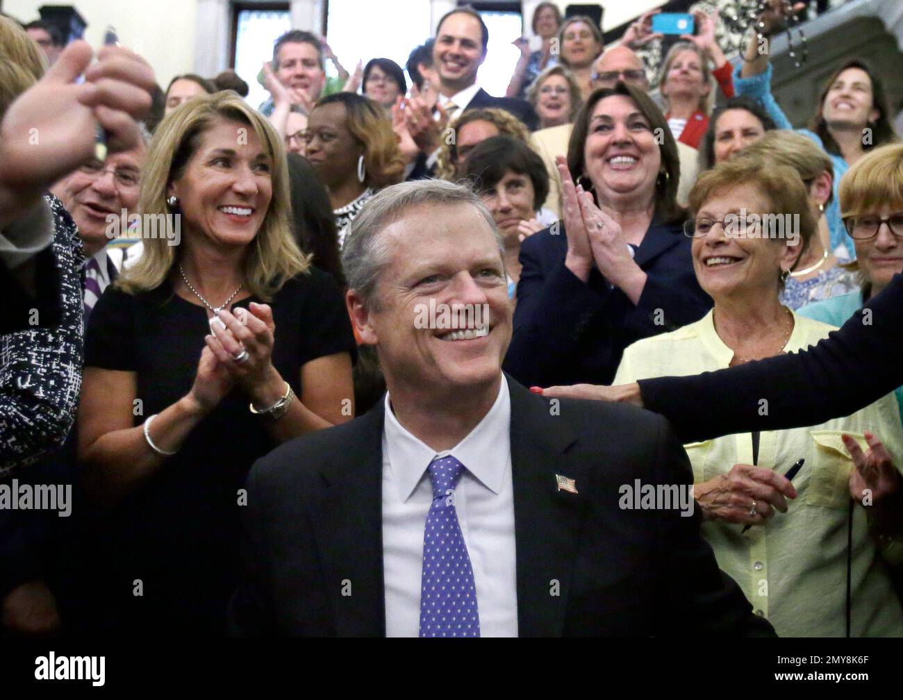 Massachusetts Gov. Charlie Baker smiles with Lt. Gov. Karen Polito ...