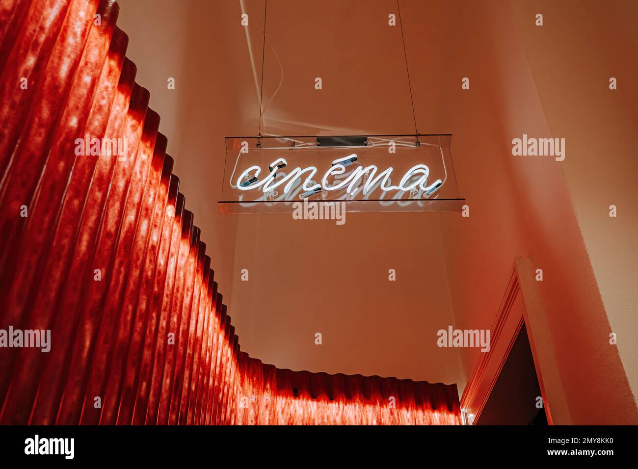 Cinema retro neon light sign before entrance to hall. picture theater ...