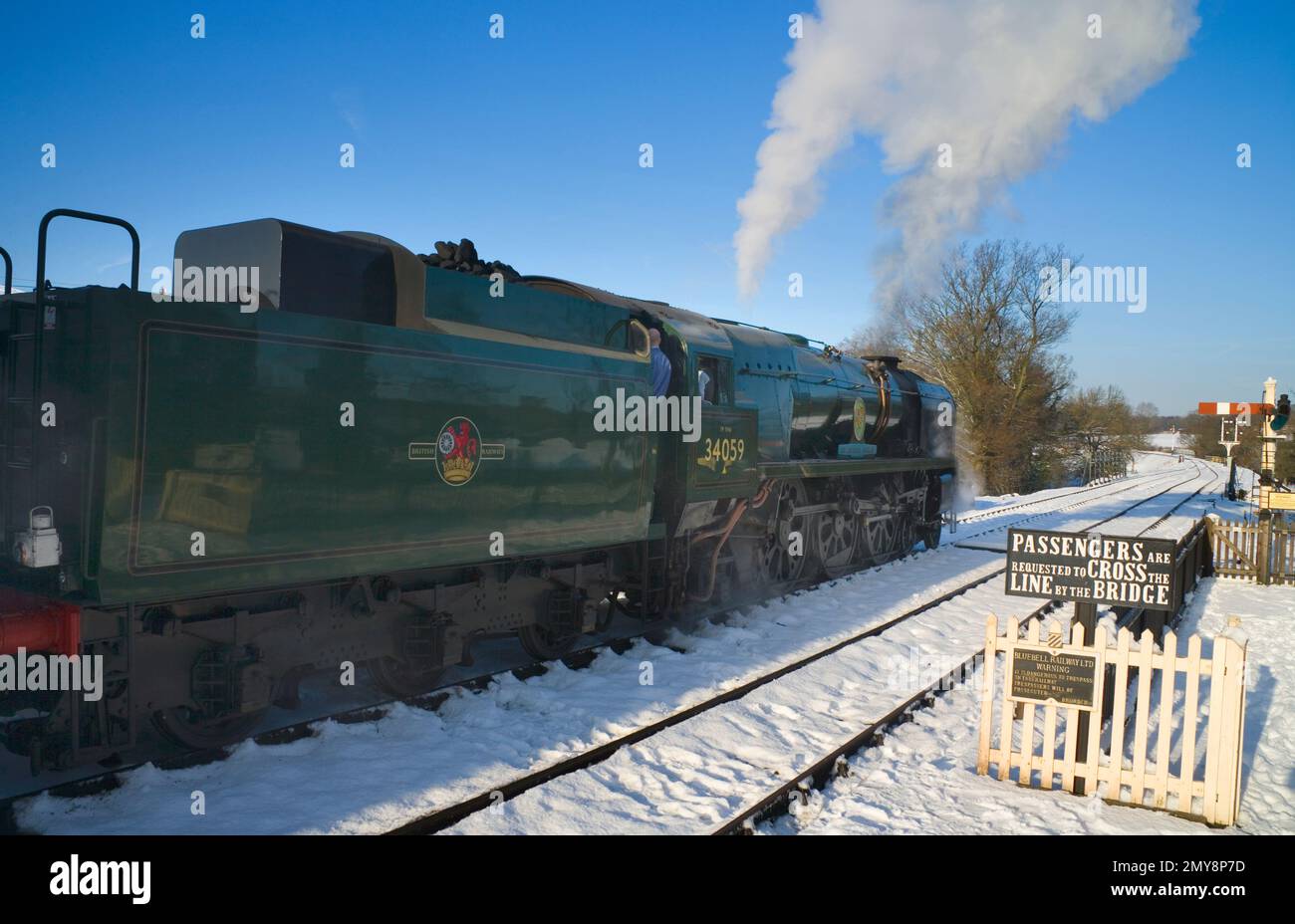 steam train and snow in winter on the bluebell railway in East Sussex ...