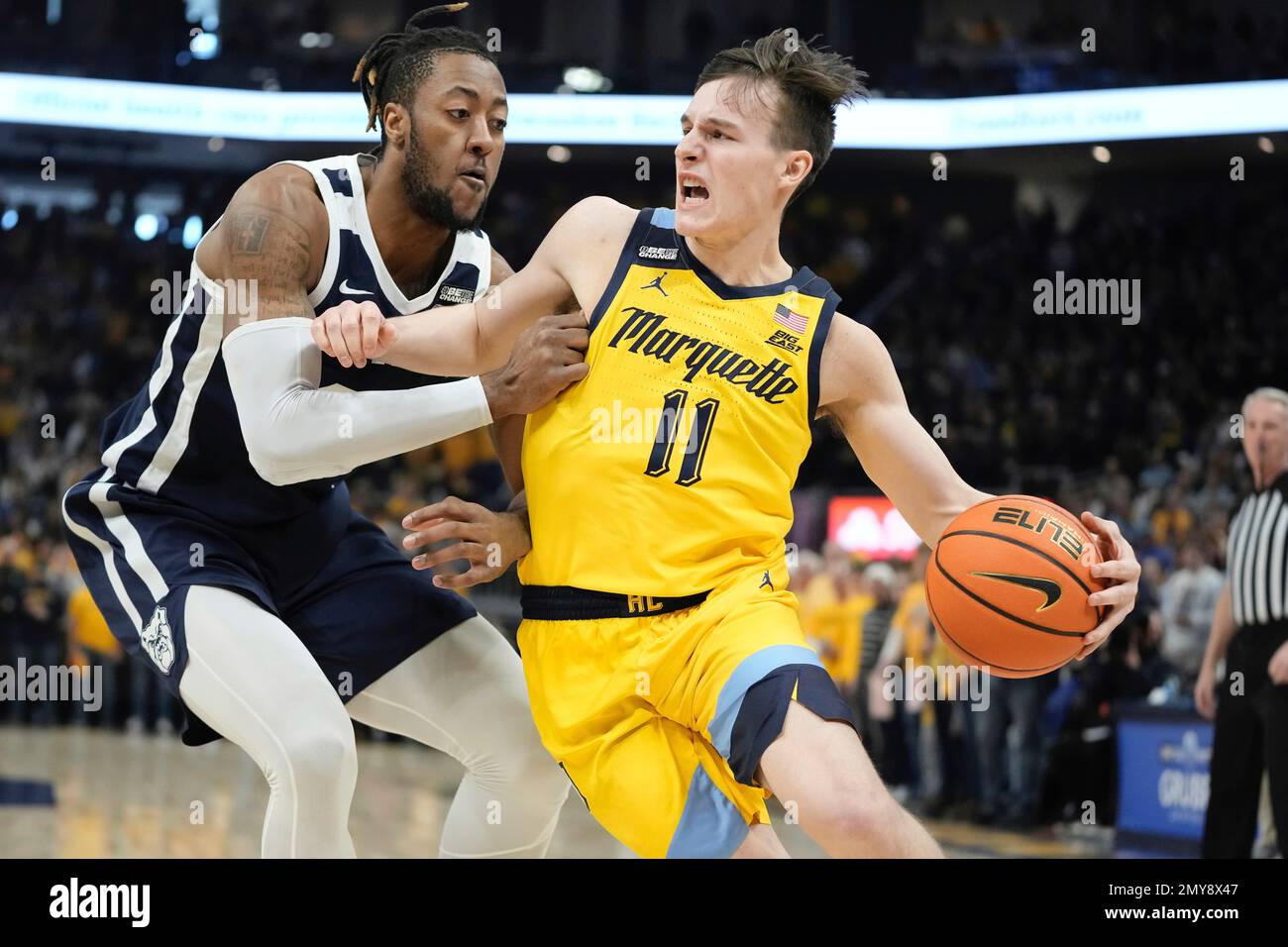 Marquette's Tyler Kolek tries to get past Butler's Manny Bates during ...
