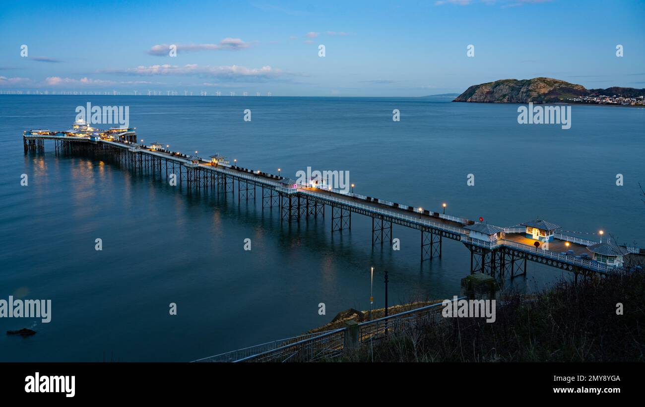 Llandudno's Victorian Pier, North Wales. The Little Orme on the top ...