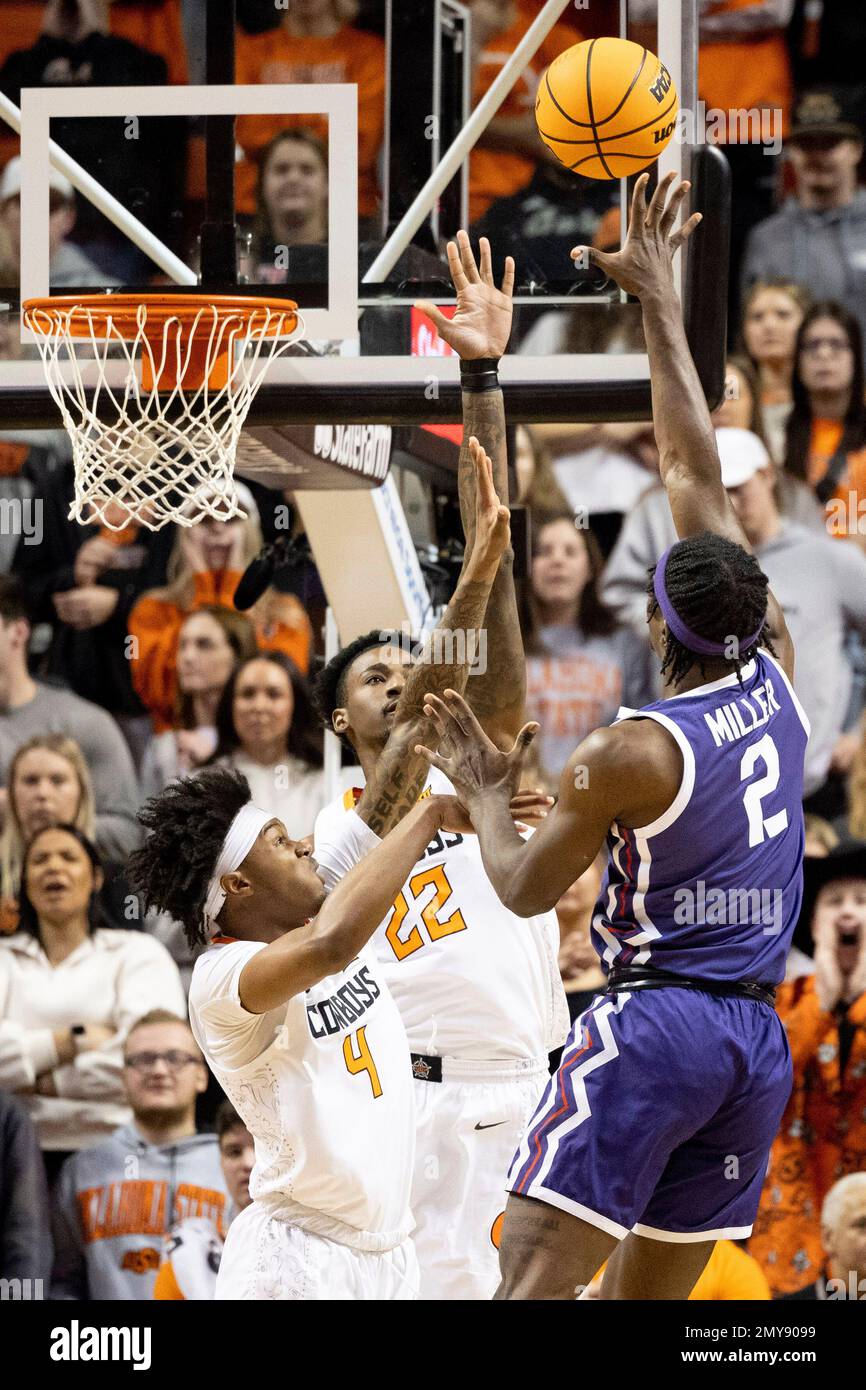 TCU's Emanuel Miller (2) shoots over Oklahoma State's Woody Newton (4 ...