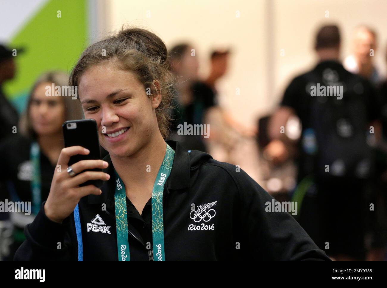 Ruby Tui of the New Zealand Olympic delegation takes a photo as she ...