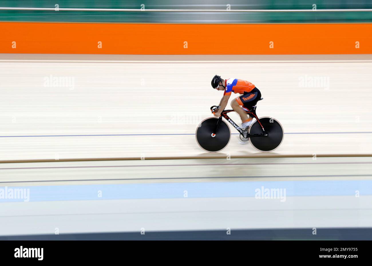 A member of the Dutch track cycling team warms up during a practice ...