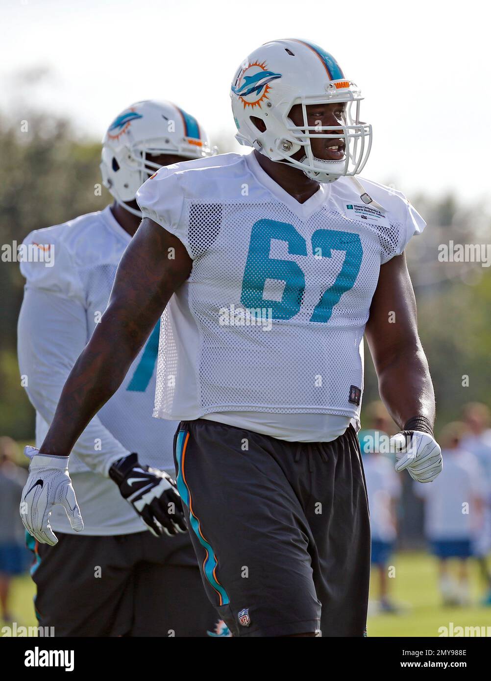 Miami Dolphins' Laremy Tunsil (67) runs a drill during the NFL football ...