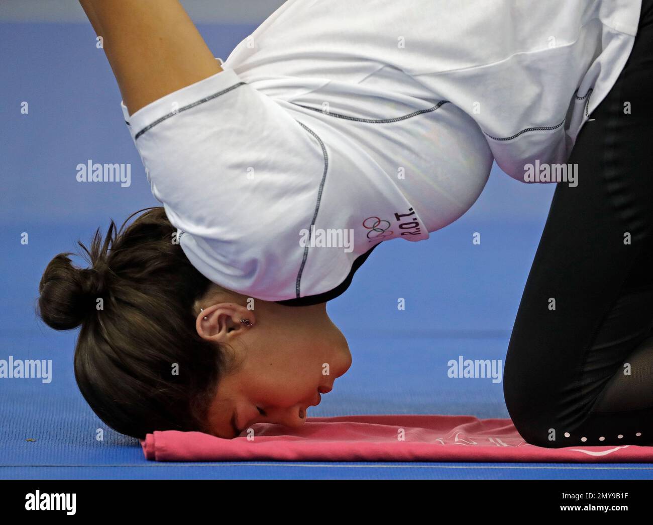 Olympic refugee team member Yusra Mardini stretches before swimming ...