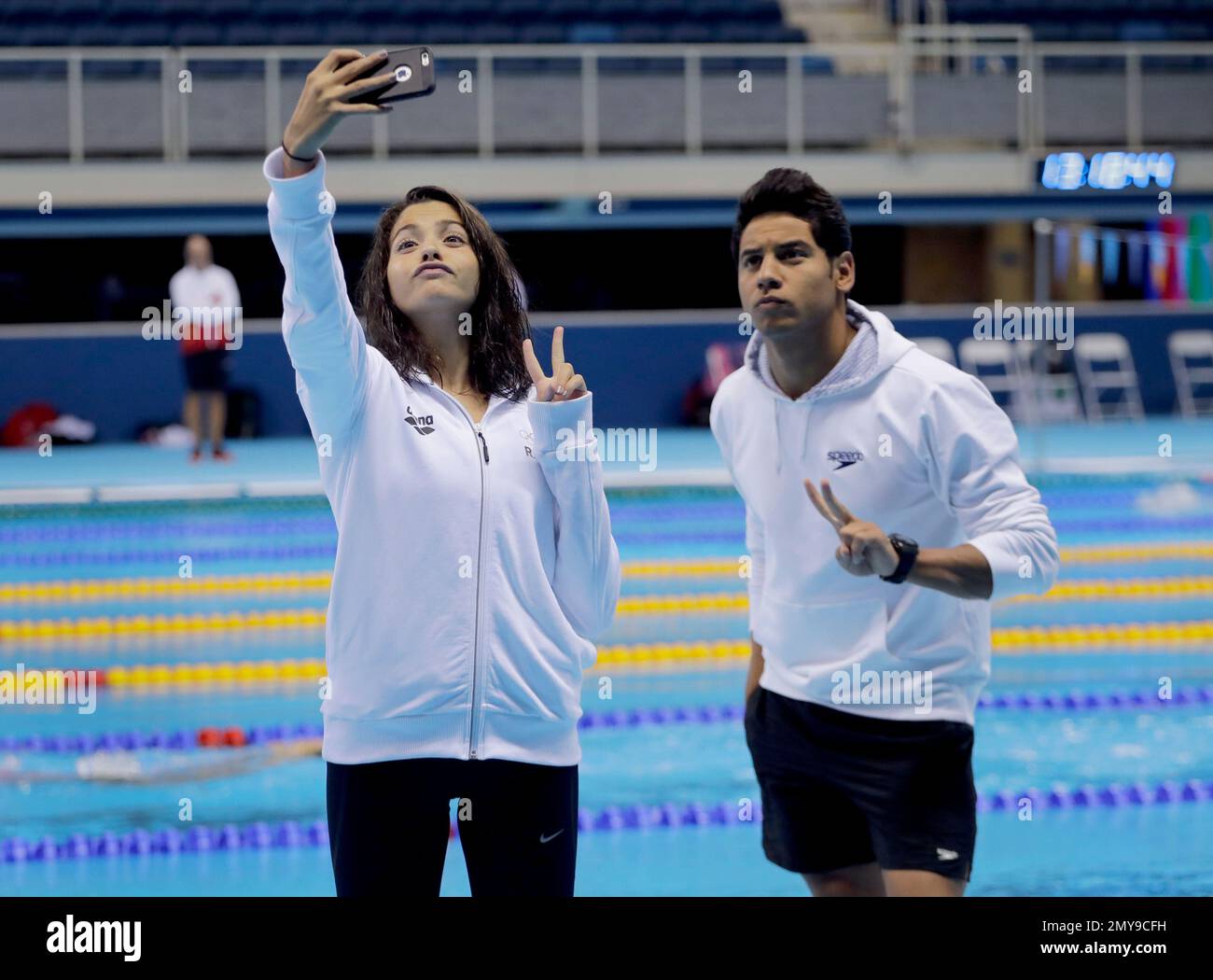 Swimmers on the Olympic refugee team Rami Anis, right, and Yusra ...