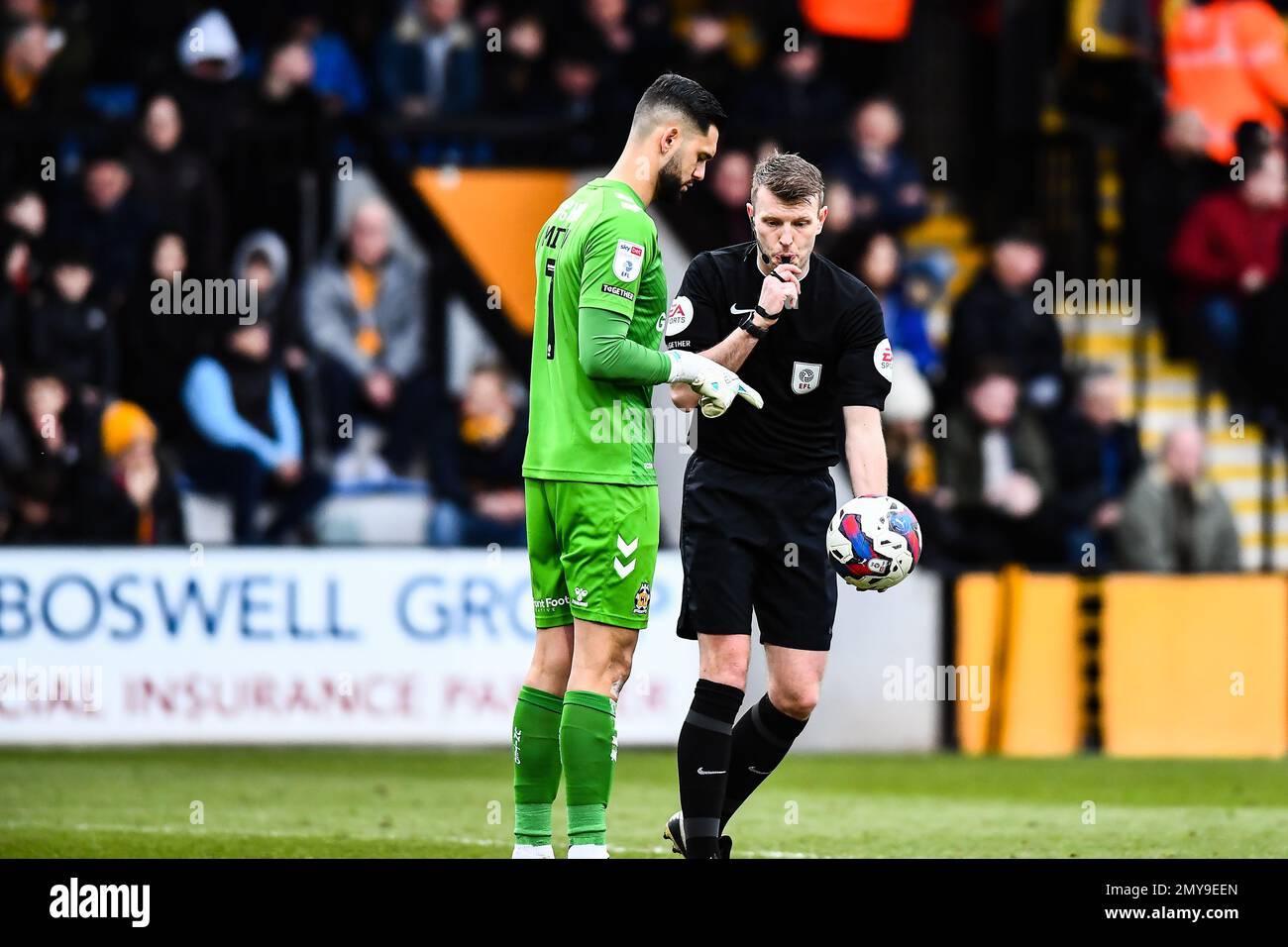 Goalkeeper Dimitar mitov (1 cambridge united) nd Referee Sam Barrott ...