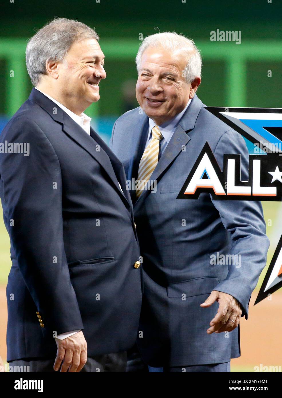 Jeffrey Loria, left, owner of the Miami Marlins, chats with Miami Mayor ...