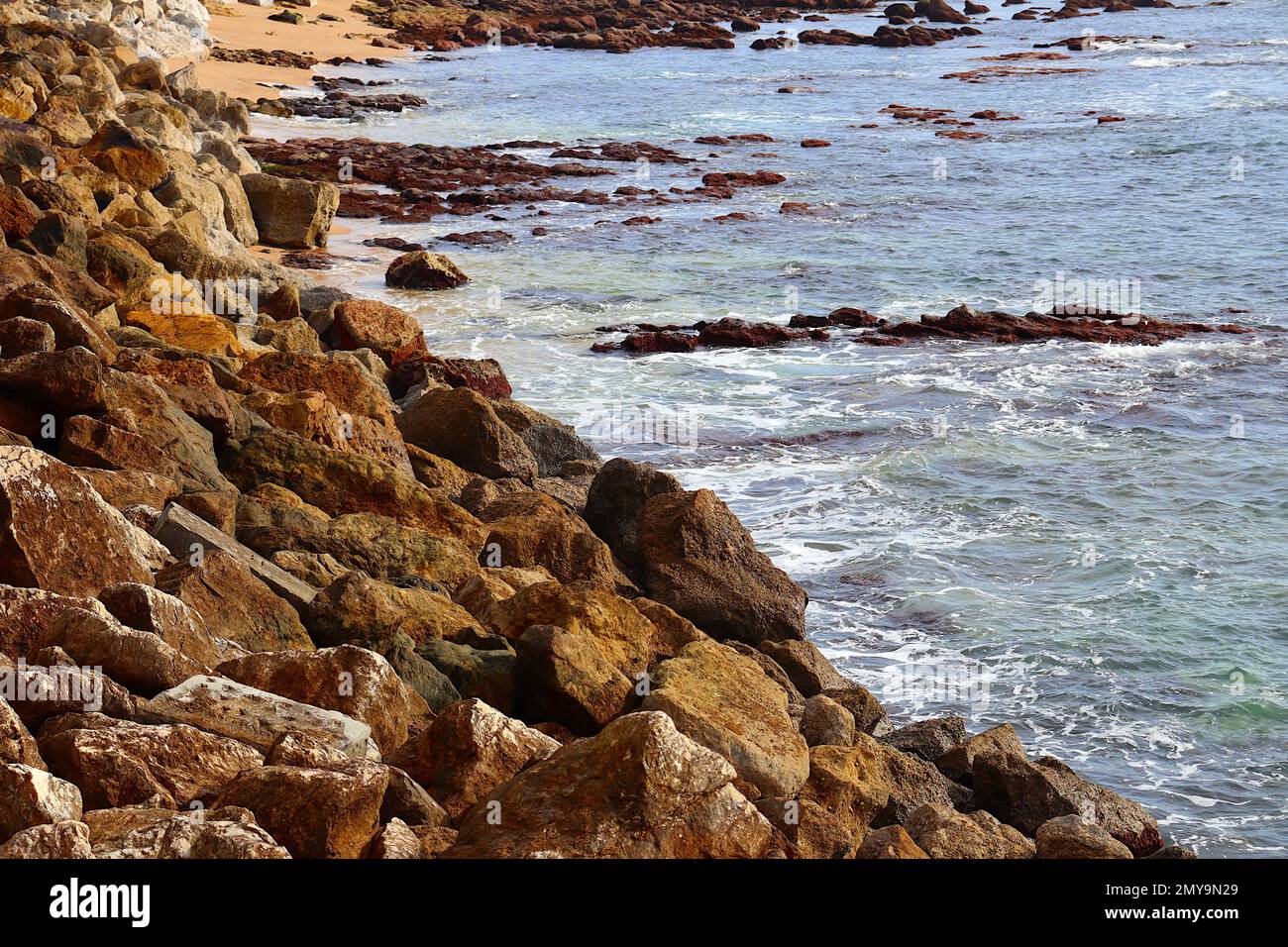 Coastline with the sea entering through irregular rocks Stock Photo - Alamy