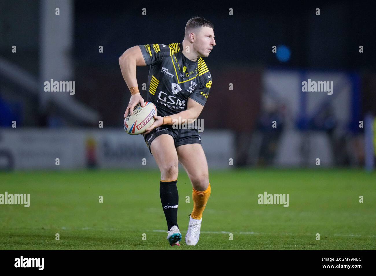 George Williams #6 of Warrington Wolves passes the ball during the ...