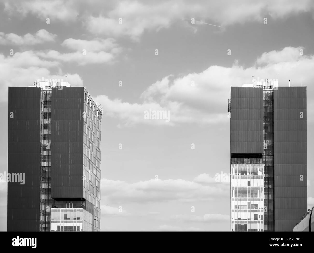 Two modern office building towers against the sky. Skyscrapers in ...
