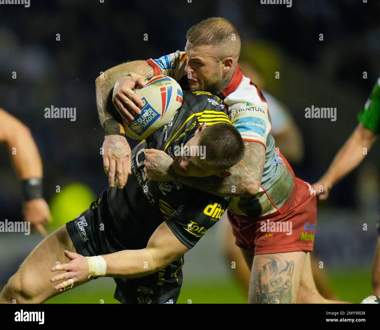 Zak Hardaker #1 of Leigh Leopards tackles Danny Walker #16 of ...
