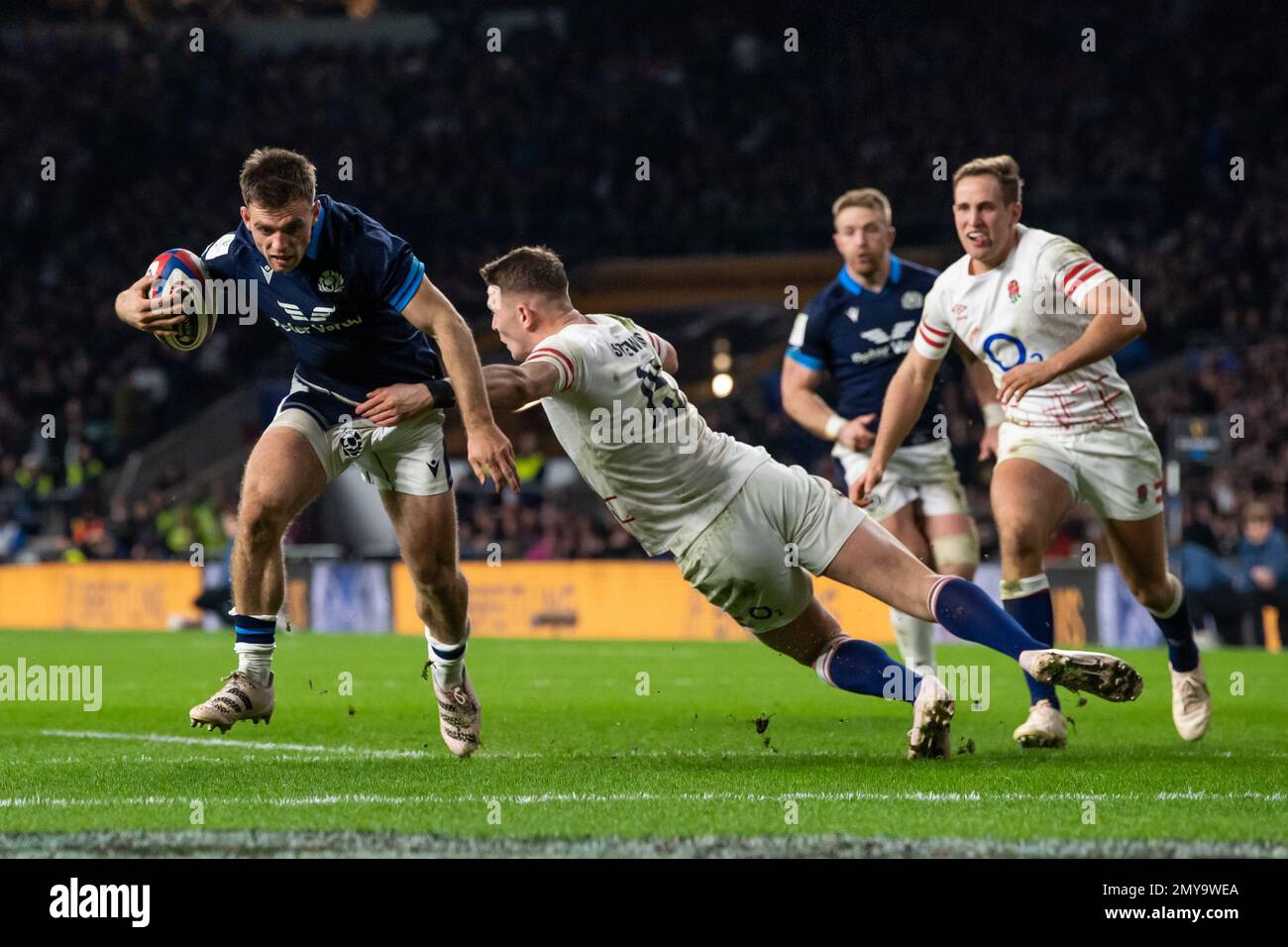 Ben White of Scotland evades the tackle of Freddie Steward of England ...