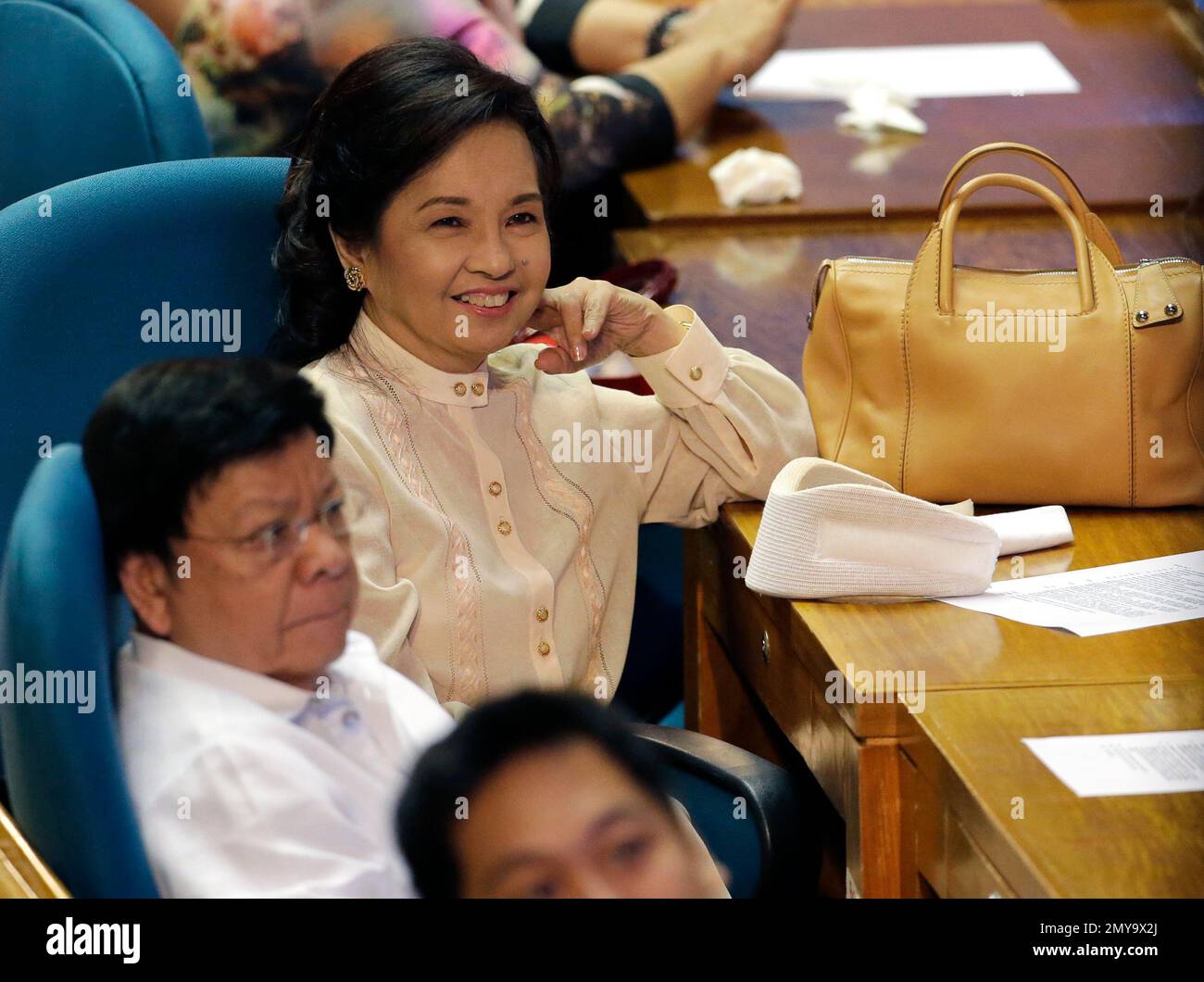 Former President and now Congresswoman Gloria Macapagal Arroyo smiles ...