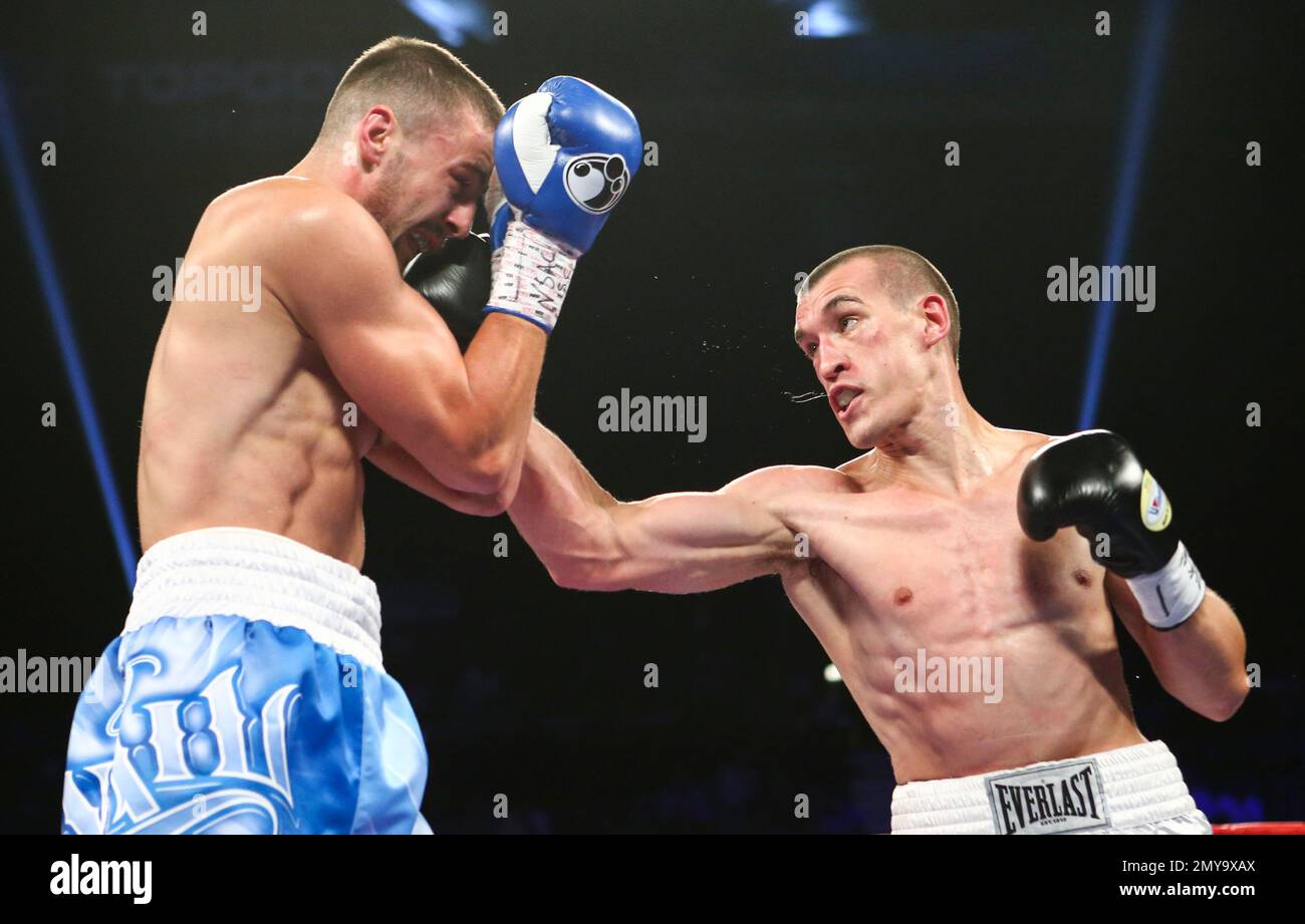 Tommy Karpency, right, hits Oleksandr Gvozdyk during their light ...