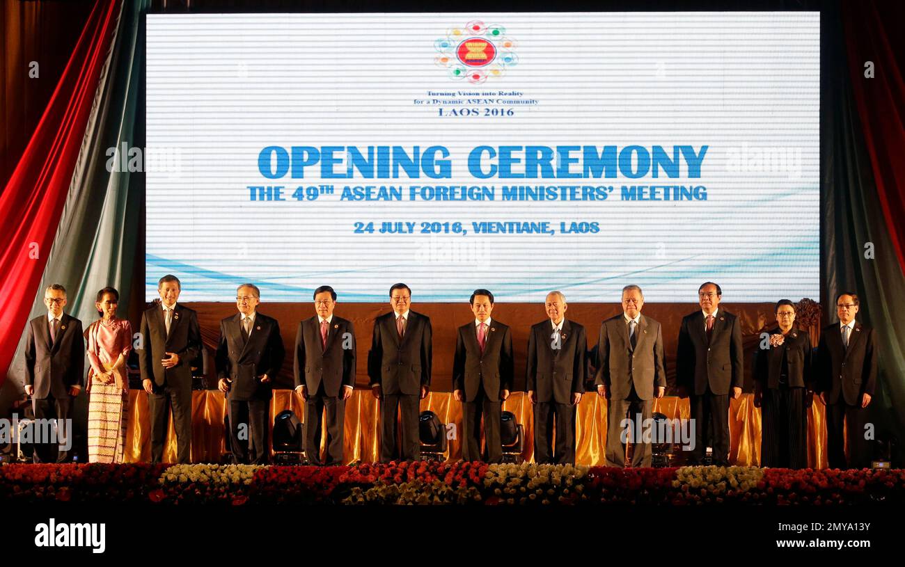 Laotian Prime Minister Thongloun Sisoulith, sixth from left, and ...