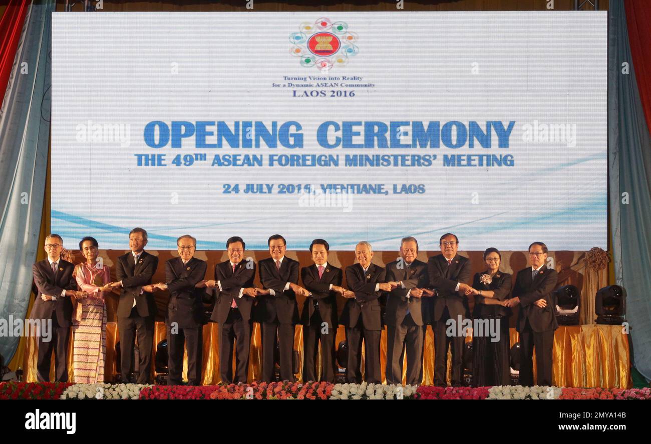 Laotian Prime Minister Thongloun Sisoulith, sixth from left, and ...