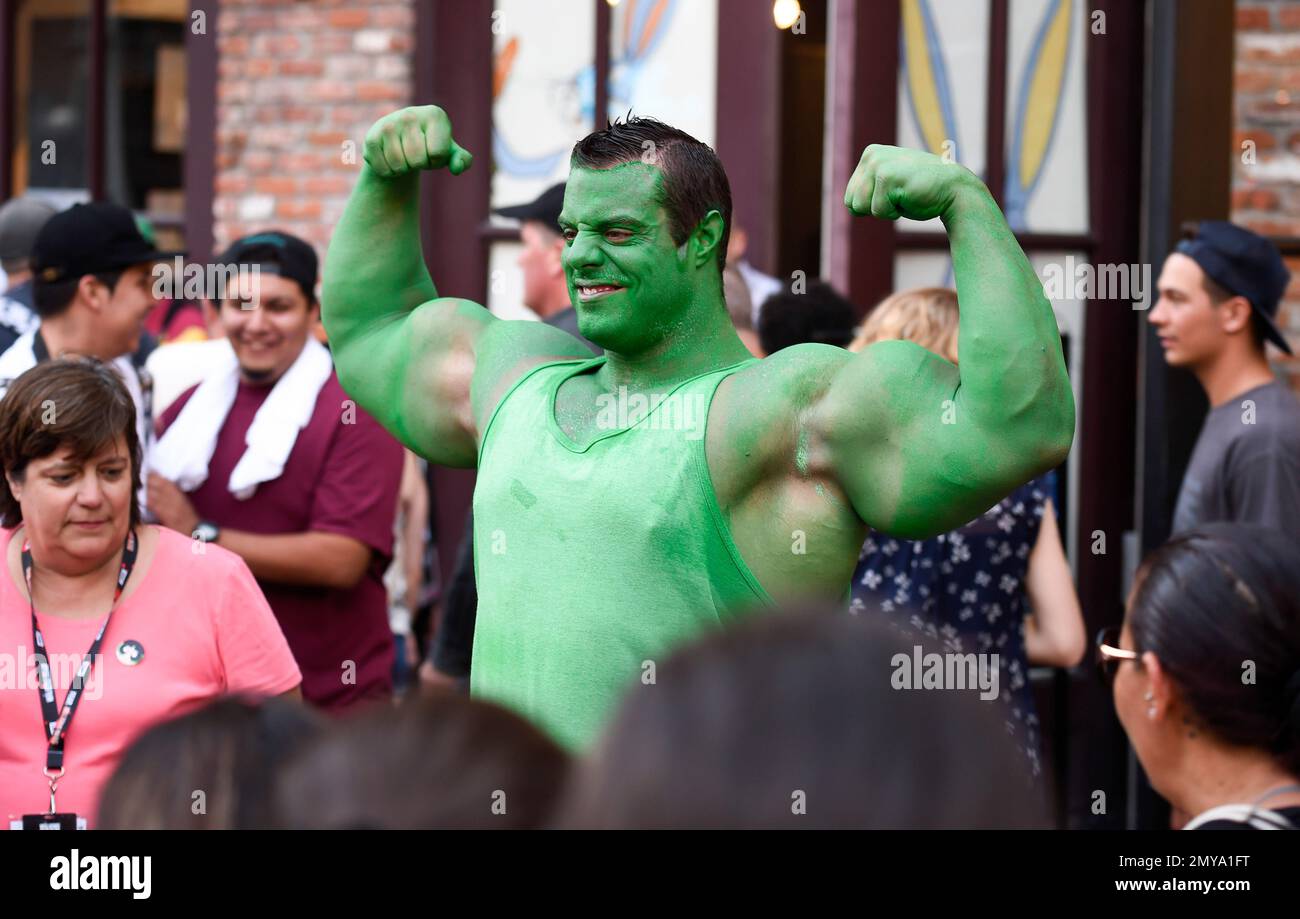 Nicholas Decabria, dressed as the Incredible Hulk, flexes his muscles ...