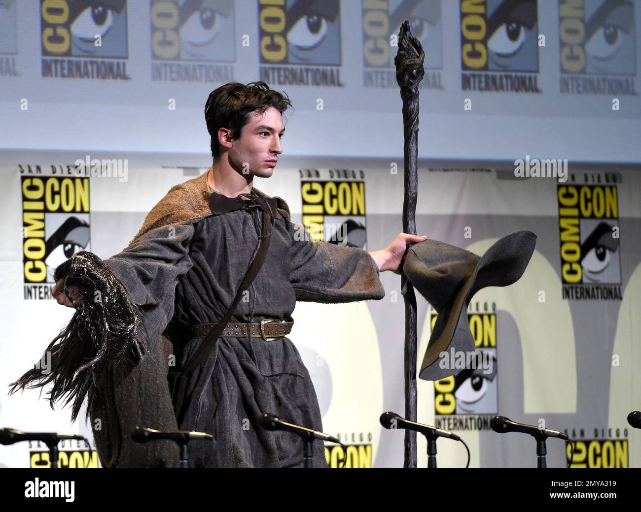 Ezra Miller, dressed as a wizard, attends the "Justice League" panel on ...