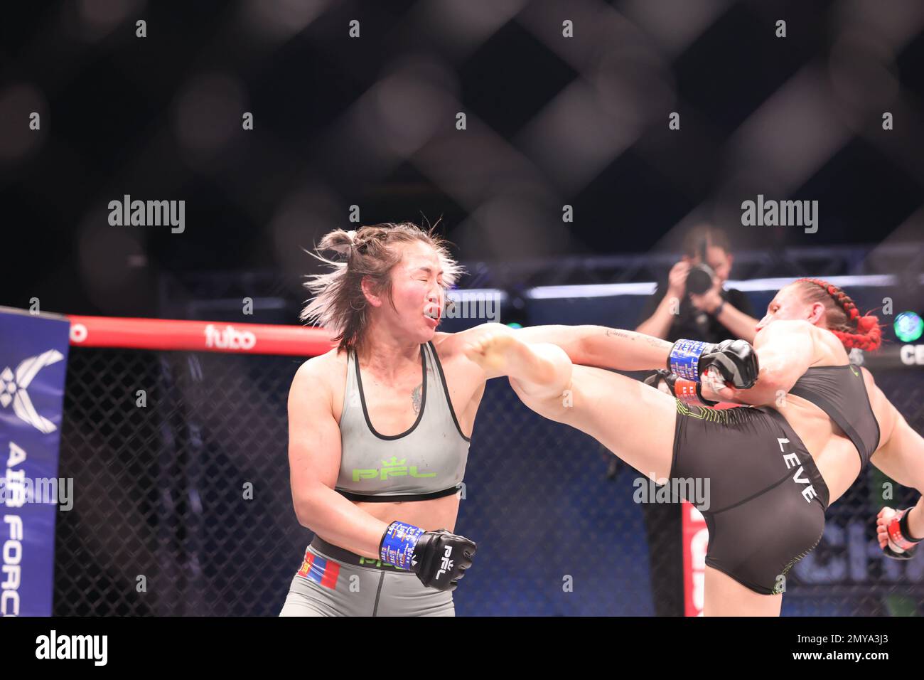 ORLANDO, FL - February 3: Naranjargal Tsend-Ayush reacts to a head kick ...