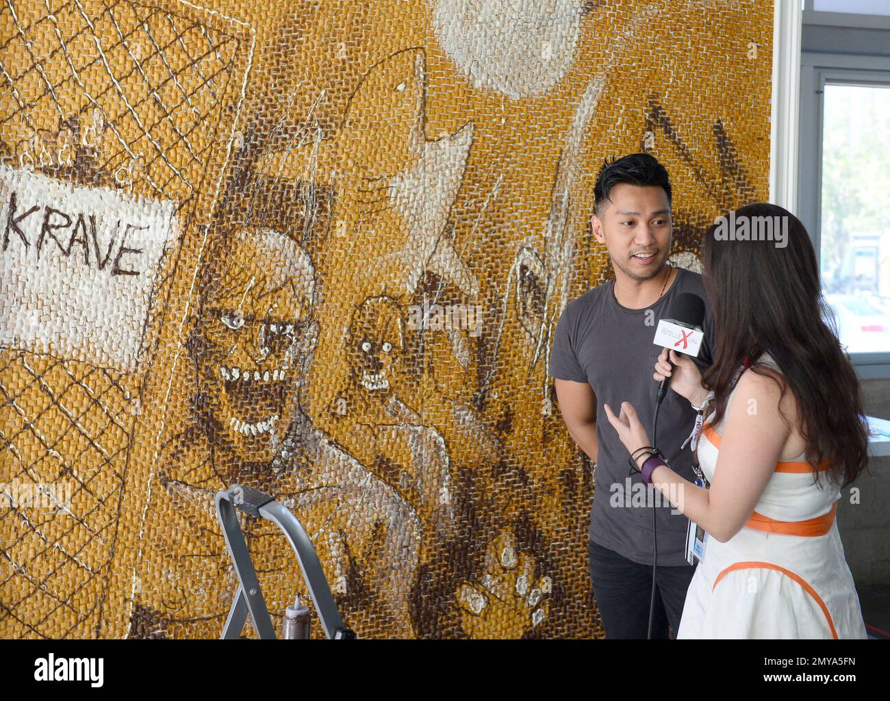 Comic illustrator Francis Manapul, left, participates in an interview ...