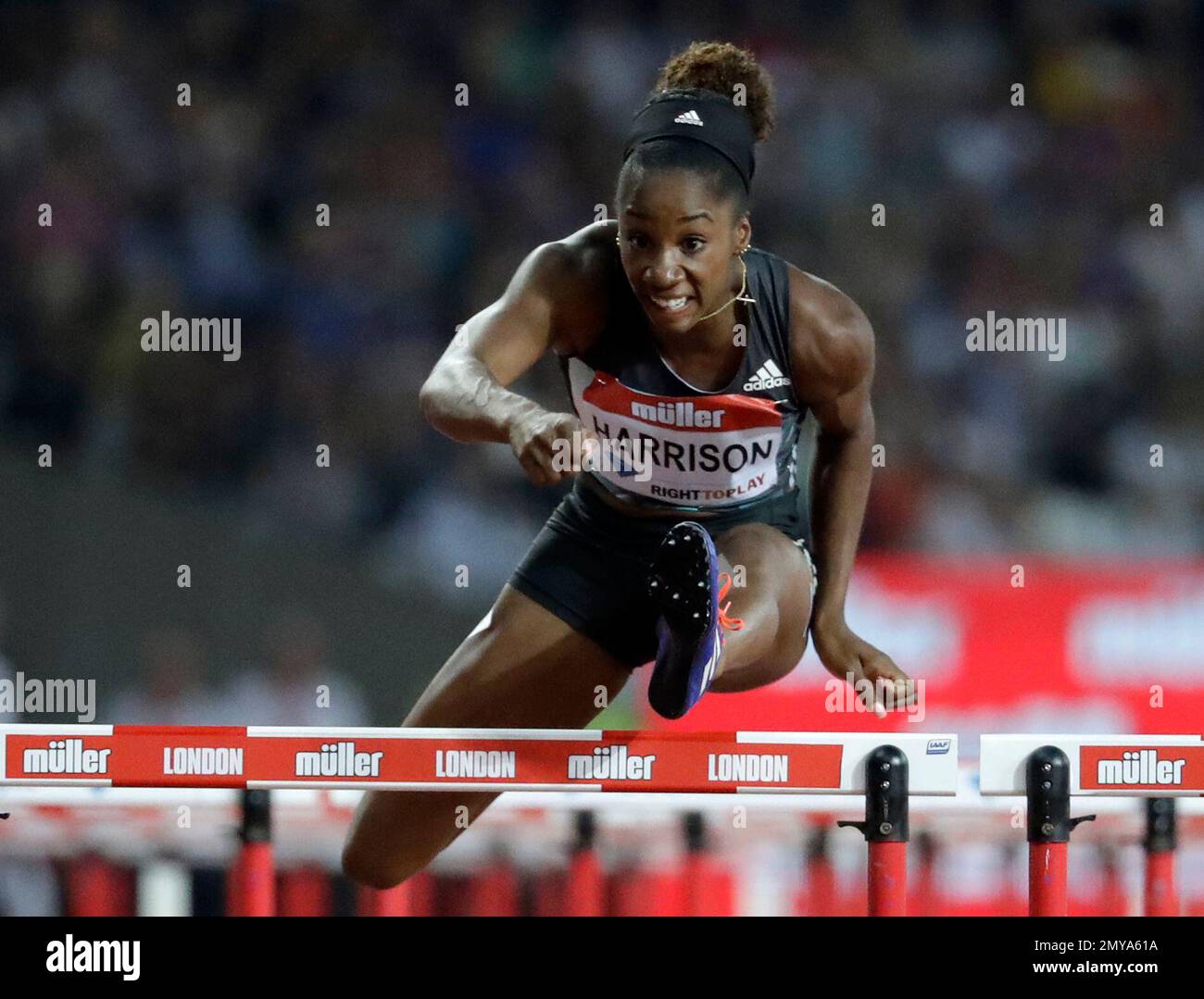 Kendra Harrison of the US clears the final hurdle as she runs on to win the women's 100 meter ...