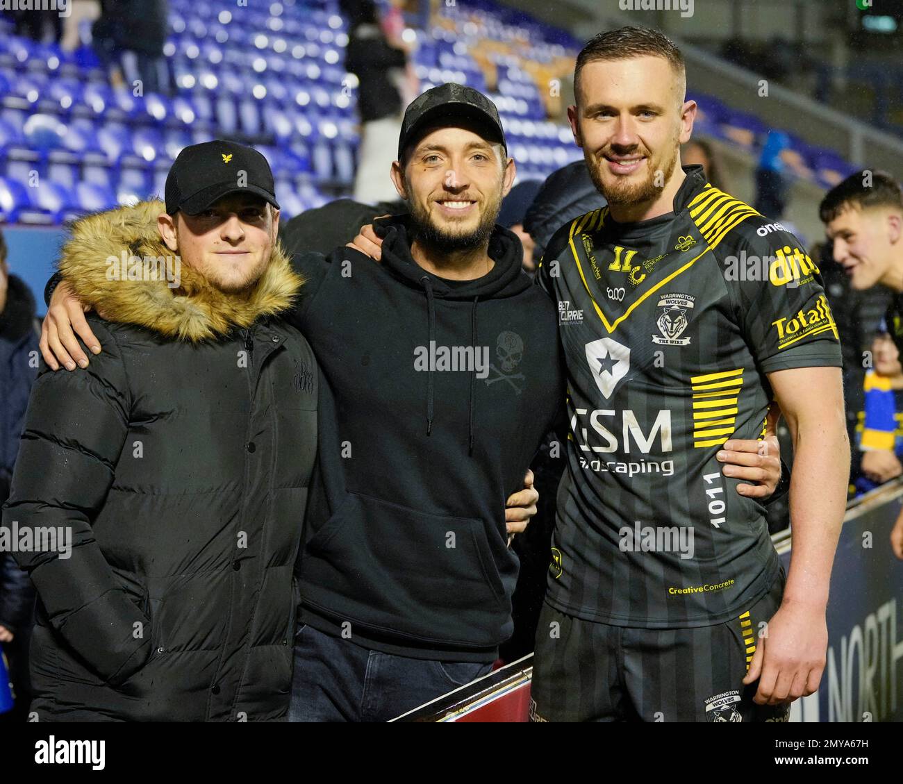 Ben Currie #11 of Warrington Wolves poses with his sponsors after the ...