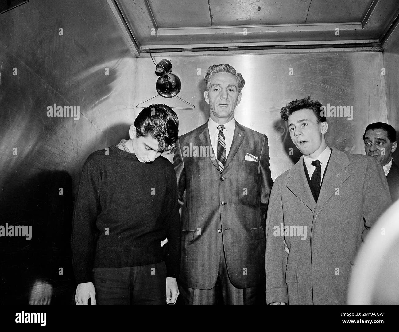 Detective Edward Griffin stands with 16-year-old Roger McShane, right ...