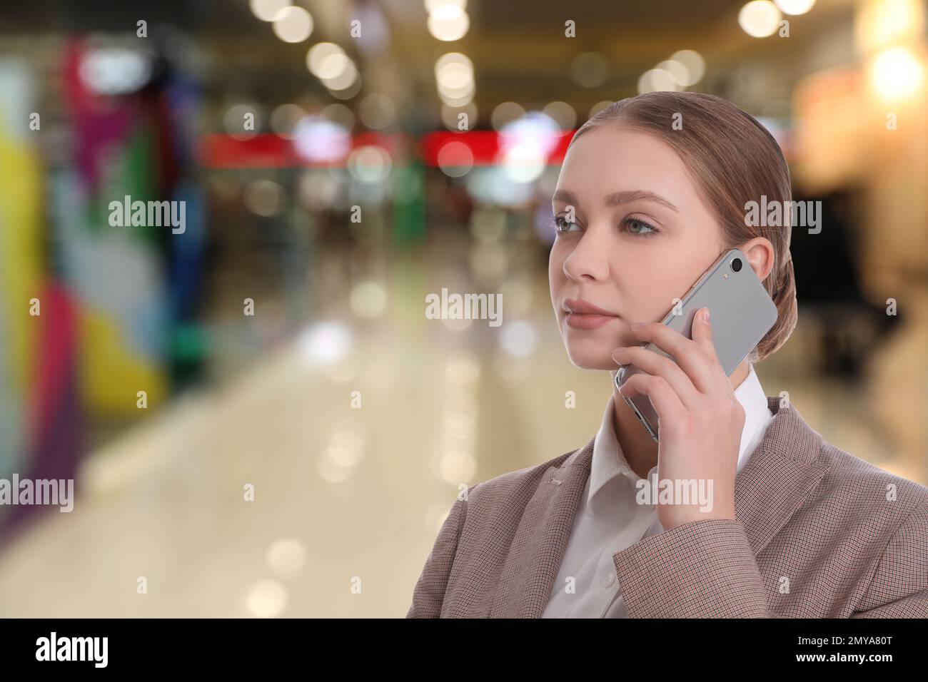 Wholesale and logistics concept. Manager talking on phone in shopping ...