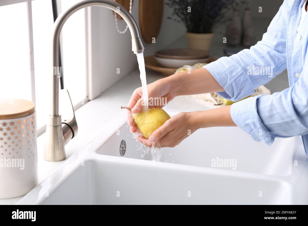 Woman cooking pear home hi-res stock photography and images - Alamy