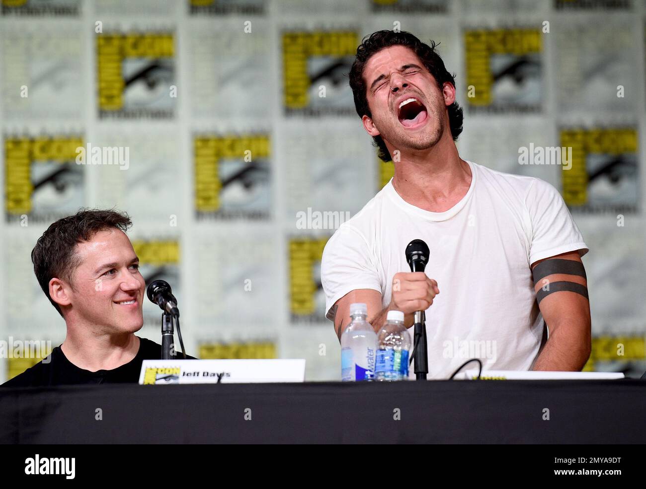 Jeff Davis, left, looks on as Tyler Posey sings at the "Teen Wolf ...