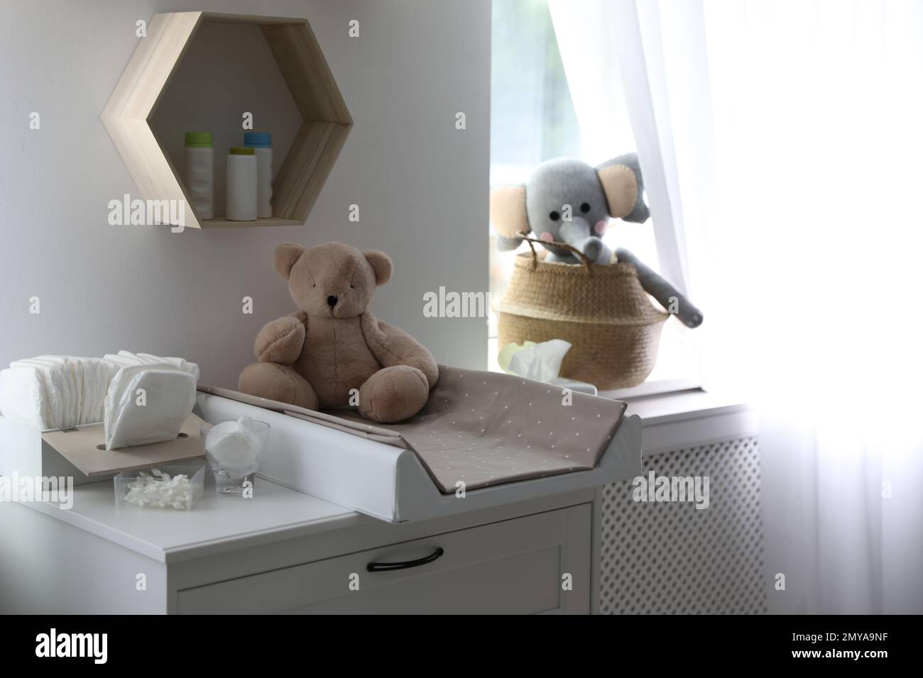 Modern changing table in baby room interior Stock Photo - Alamy