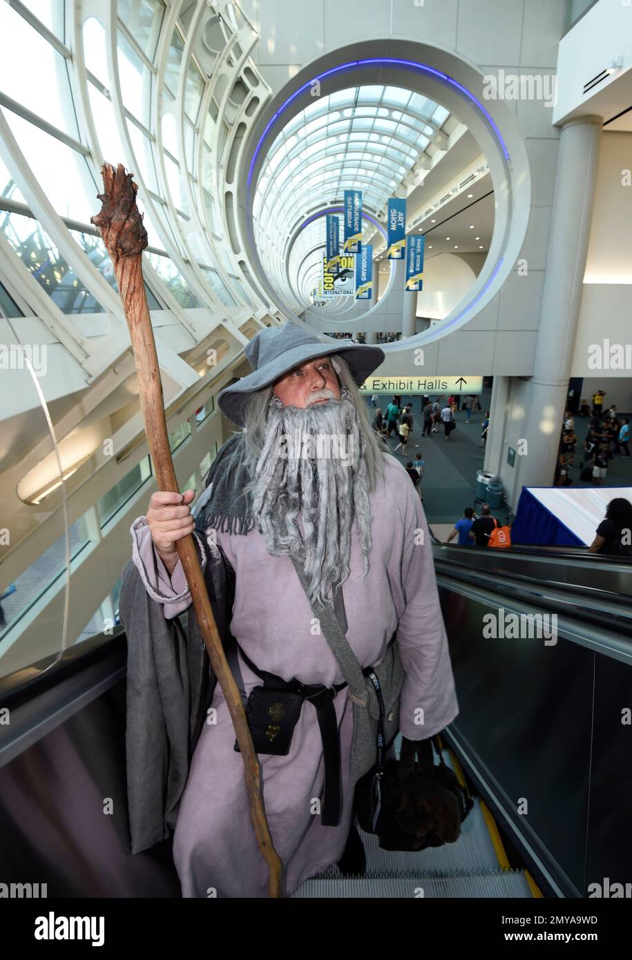 Mark Renshaw, dressed as Gandalf, rides the escalator on day one of ...
