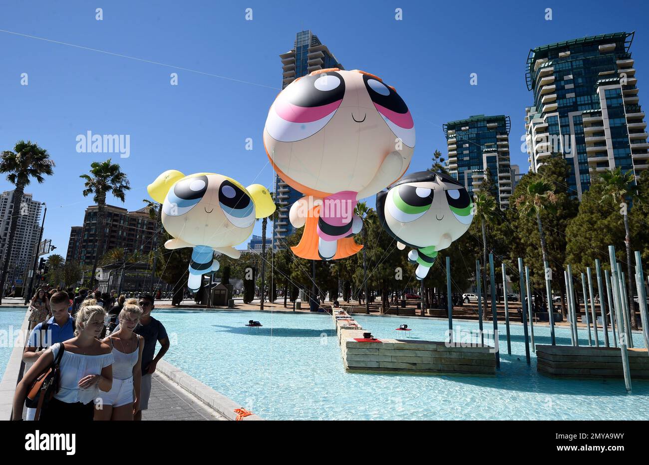 Fans walk past floating Cartoon Network Powerpuff Girls on day one of ...