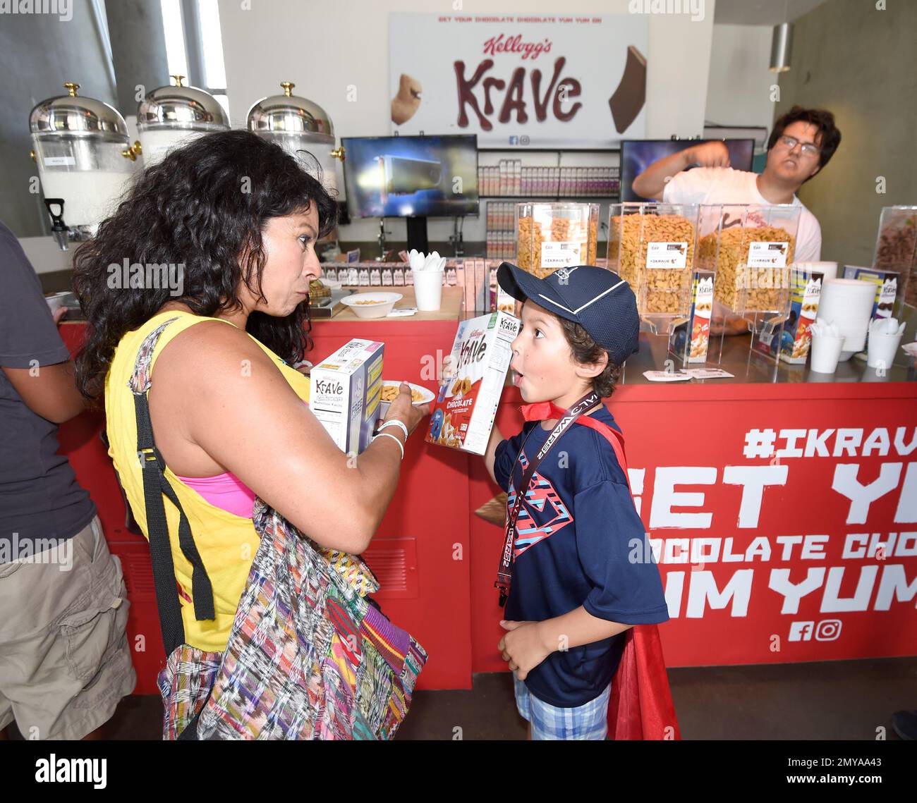 Anna Mongeon, left, and Noah Padilla pose with boxes of cereal at the ...