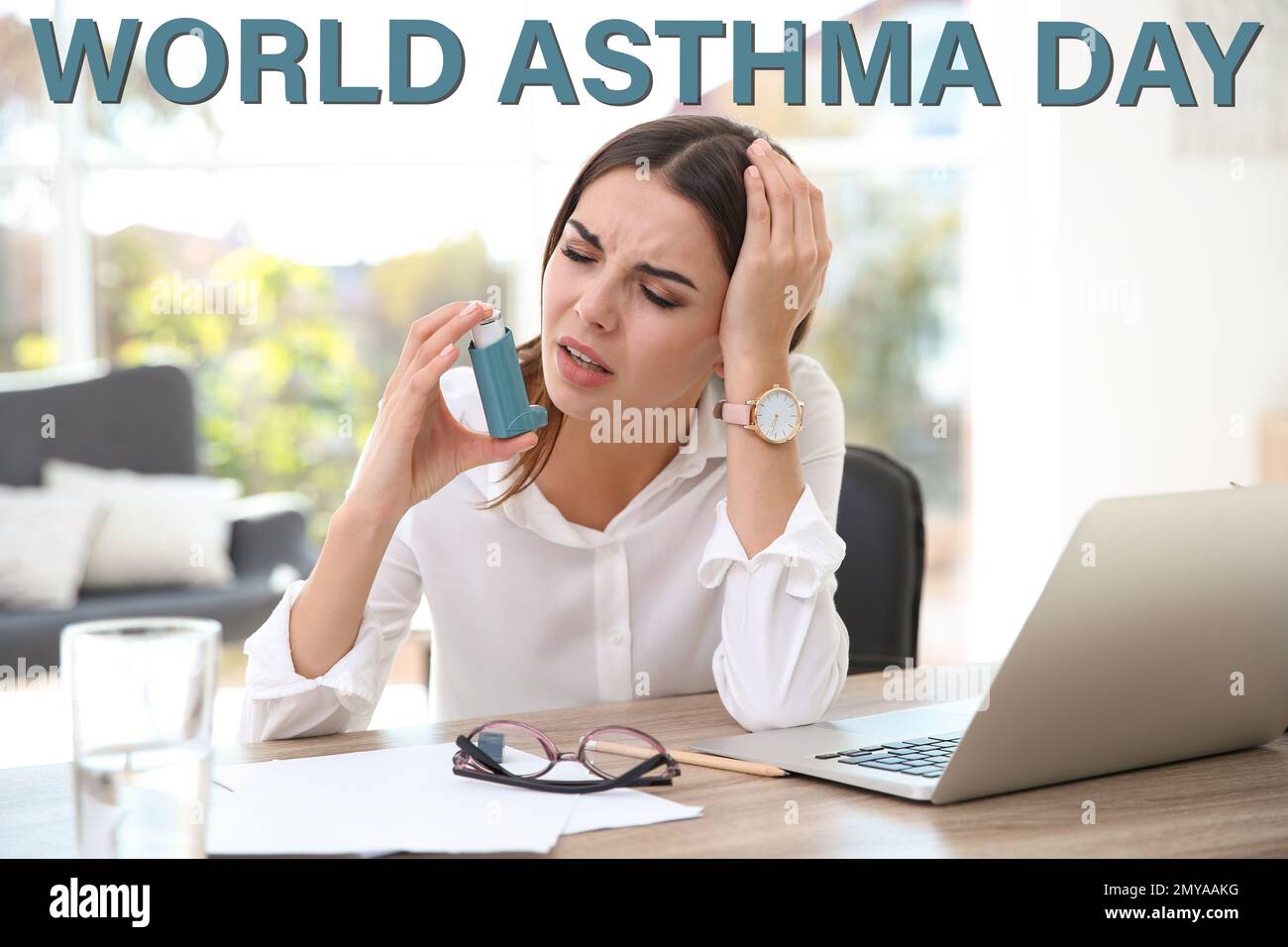World asthma day. Young woman using inhaler at table in office Stock ...