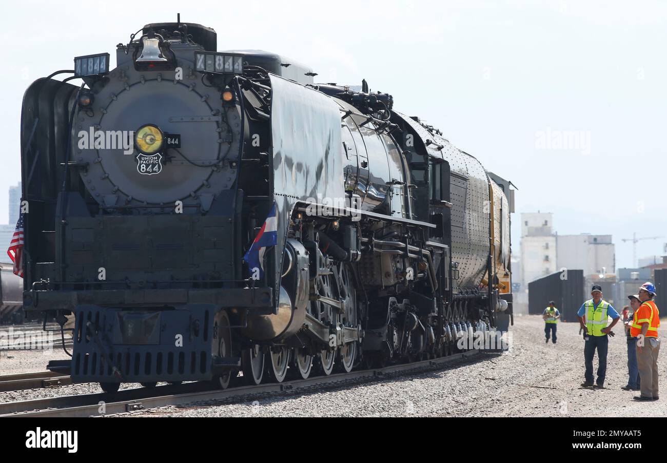 Employees look on as Union Pacific Railroad's No. 844 steam locomotive ...