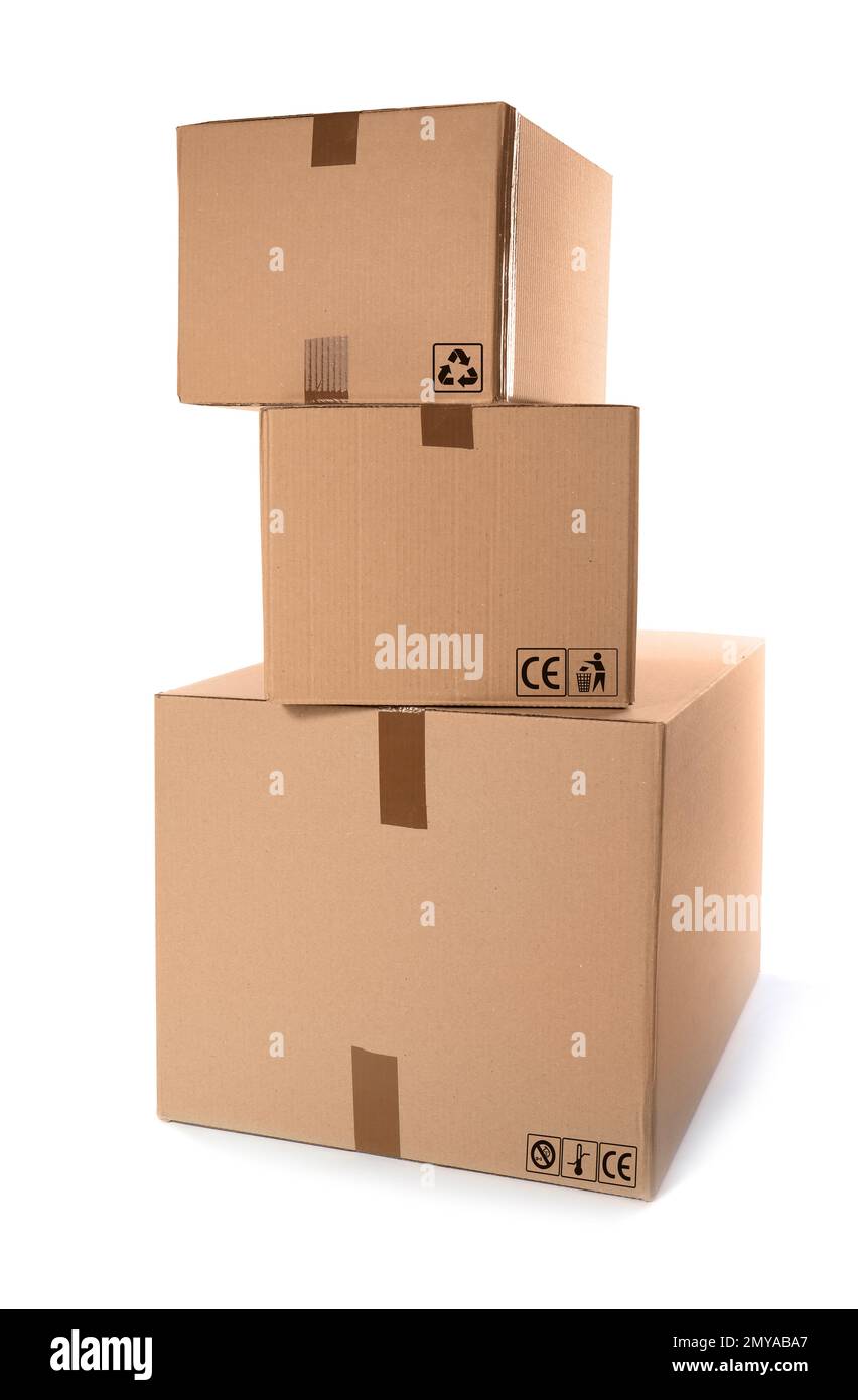 Stack of parcels with different packaging symbols on white background ...