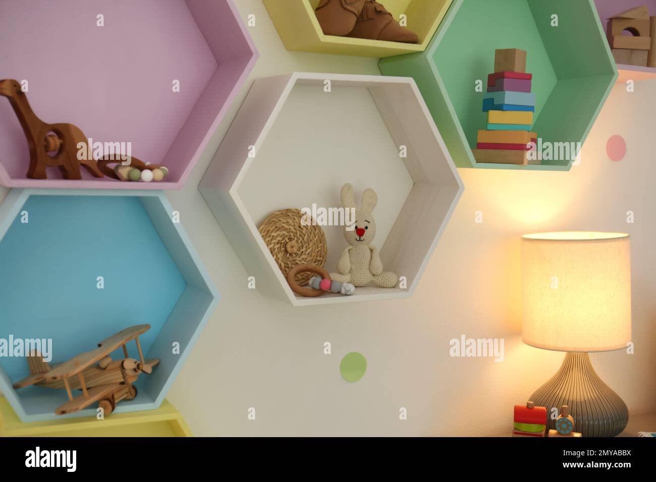 Bright colorful shelves on light wall in room. Interior design Stock ...