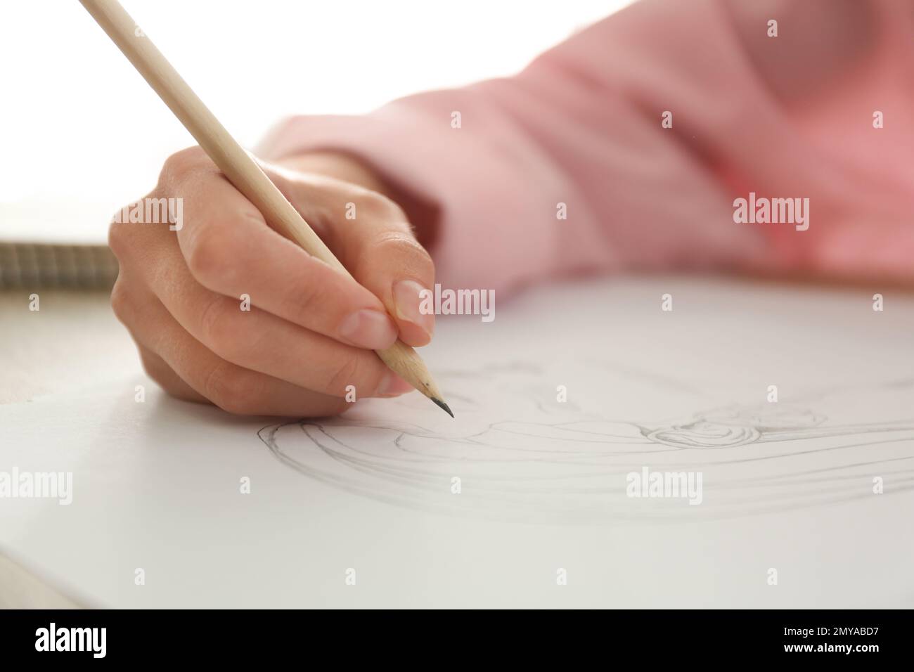 Female hand drawing on sheet hi-res stock photography and images - Alamy