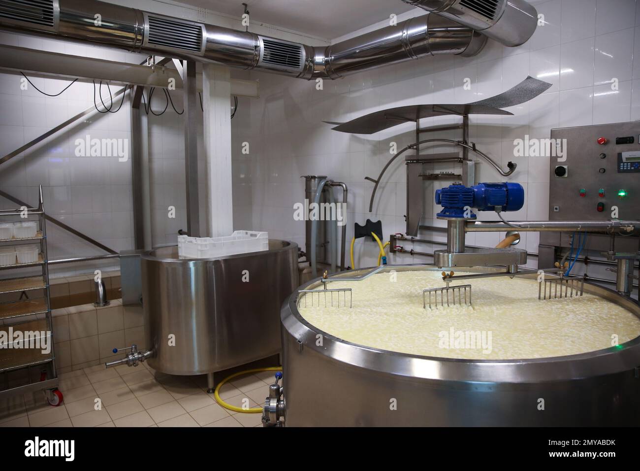 Curd and whey in tank at cheese factory Stock Photo - Alamy