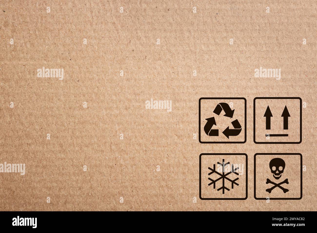 Cardboard box with packaging symbols as background, closeup Stock Photo ...