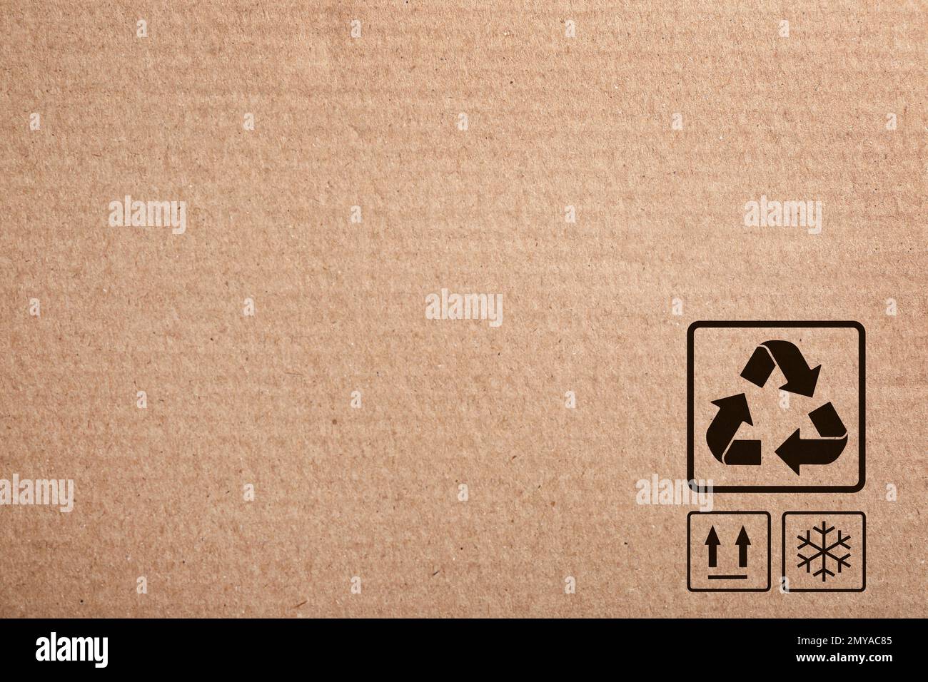 Cardboard box with packaging symbols as background, closeup Stock Photo ...