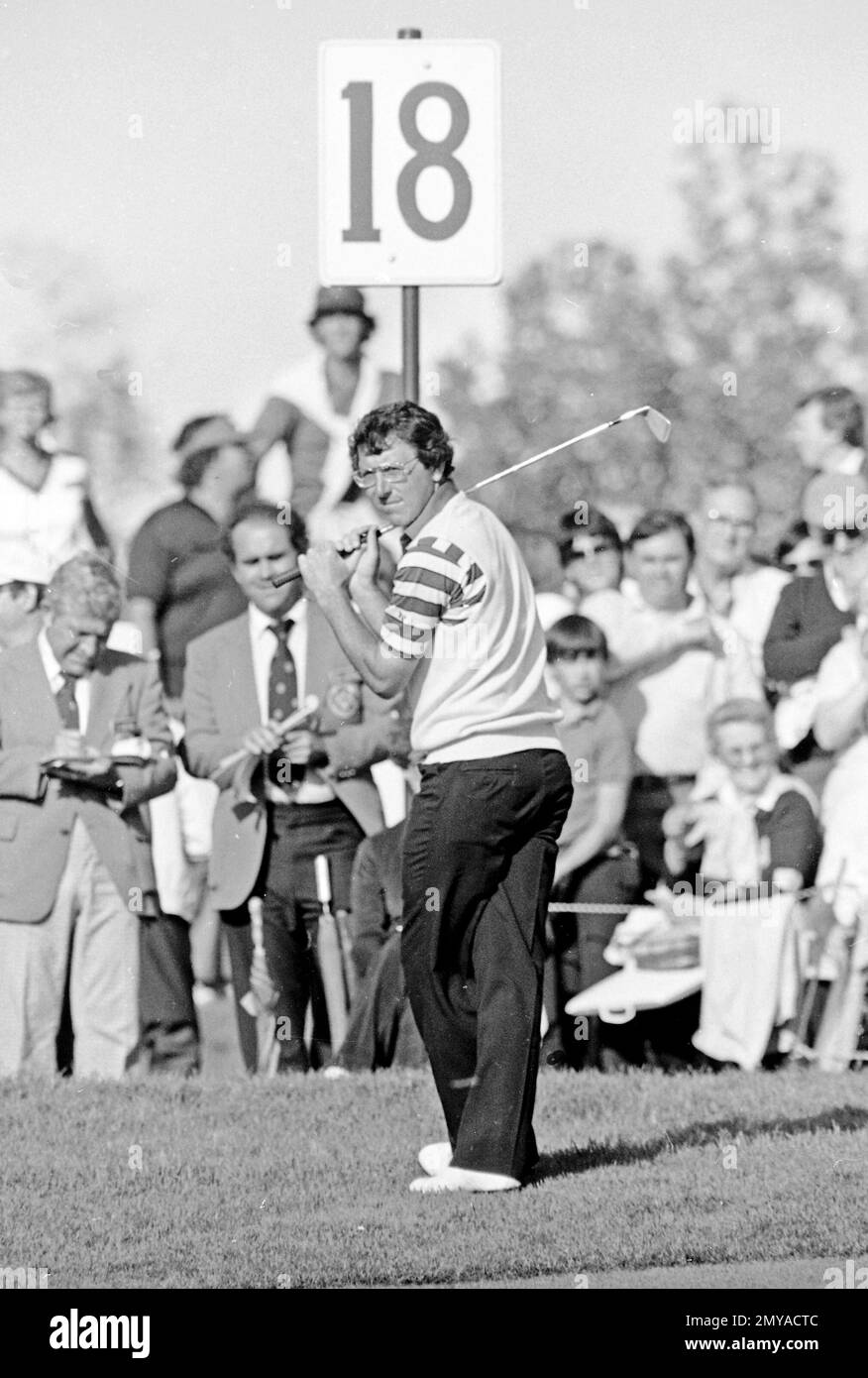 Hale Irwin twists himself around while watching his putt on the 18th ...