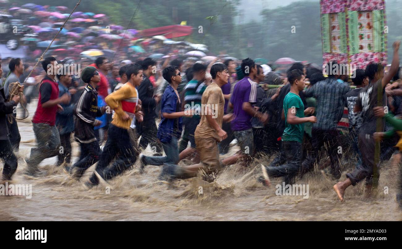 Indian Pnar or Jaintia tribesmen carry a 'Rong' or chariot and dance in ...
